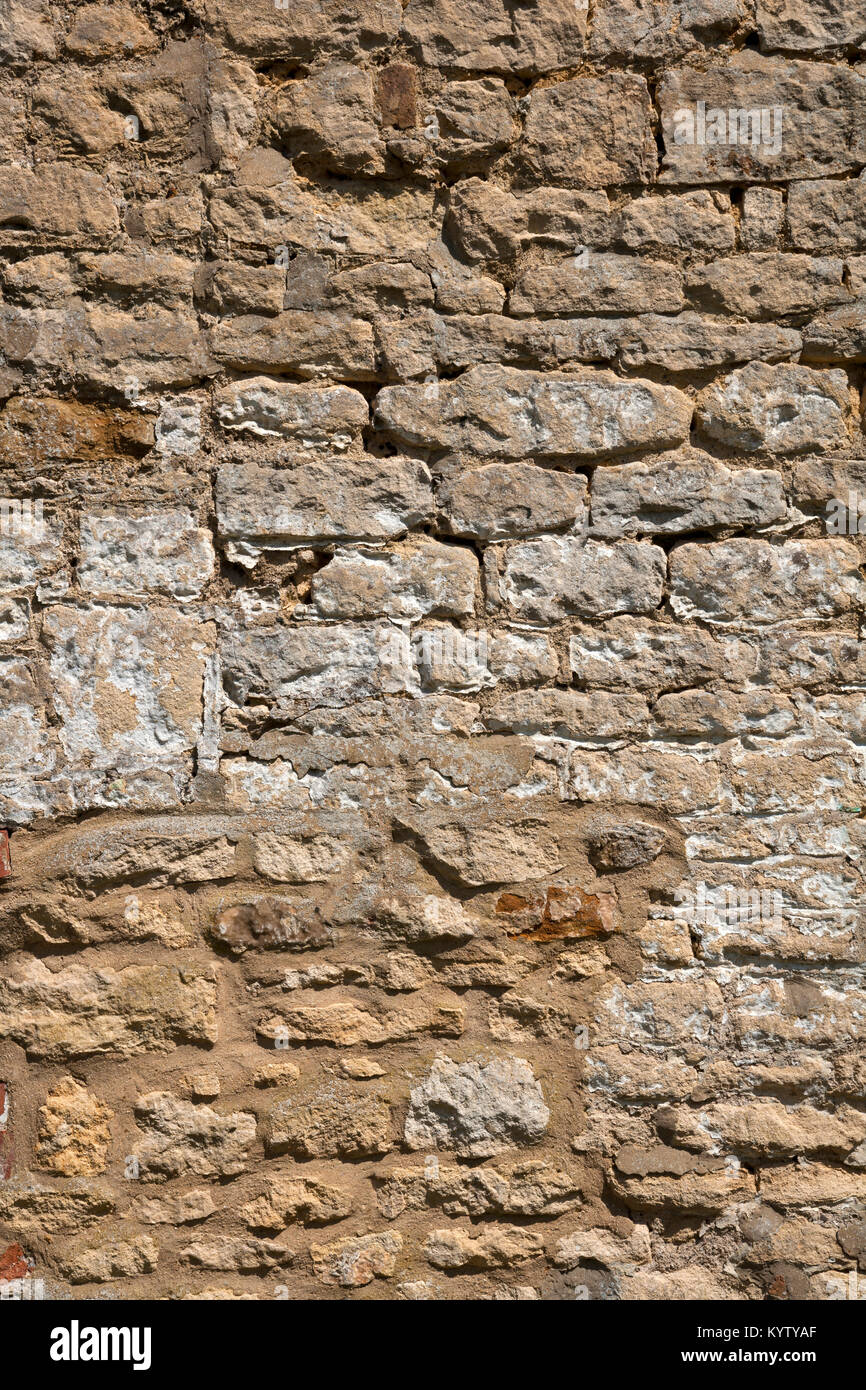 An old weathered stone wall needs repairs. Construction full frame ...