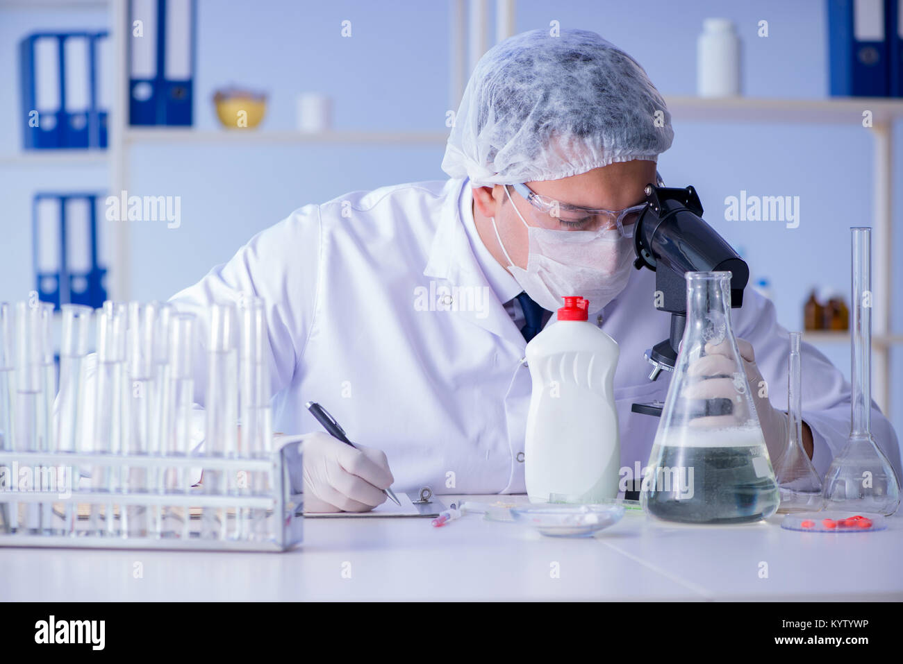 Man in the lab testing new cleaning solution detergent Stock Photo - Alamy