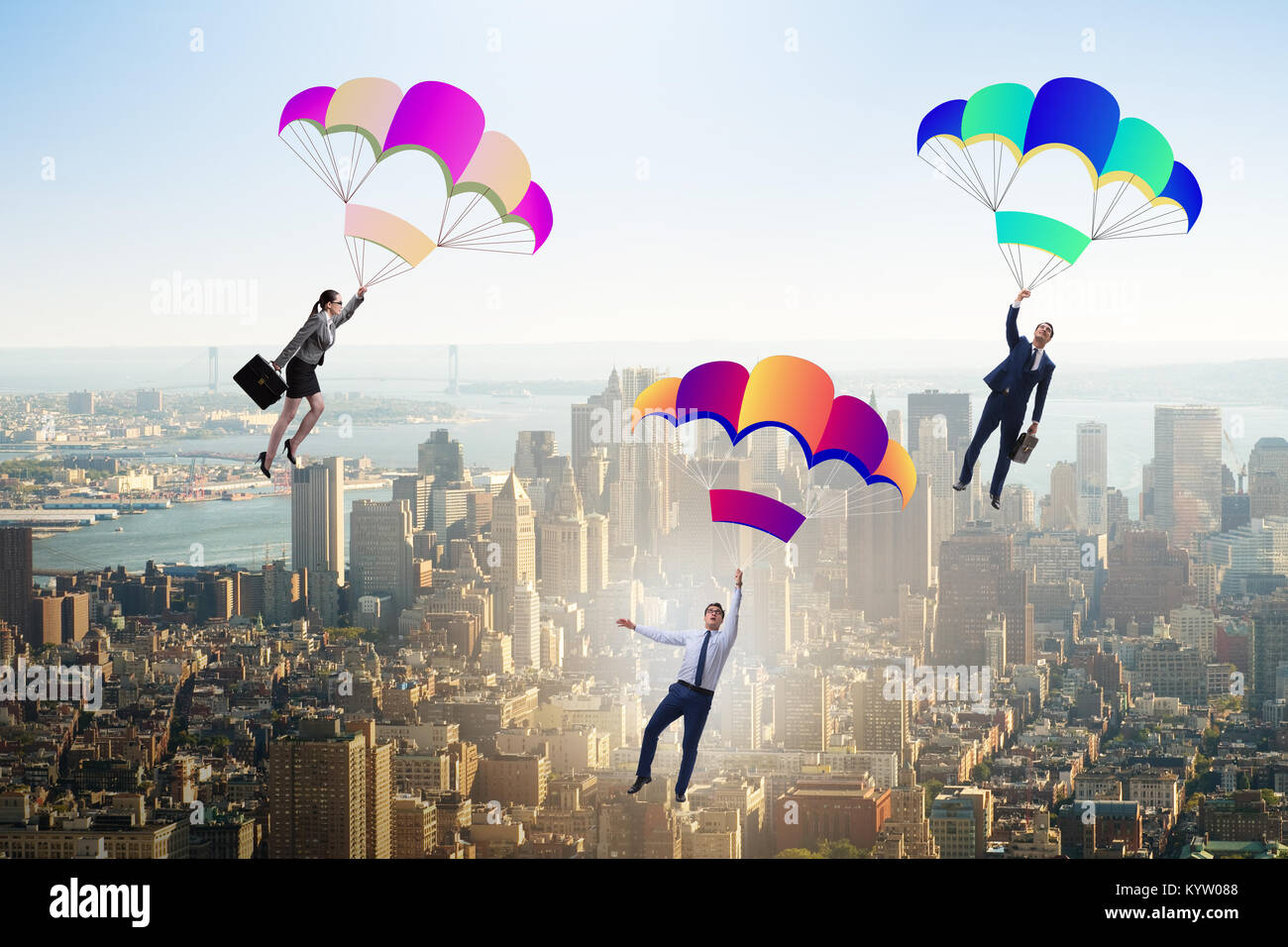 Business people falling down on parachutes Stock Photo - Alamy
