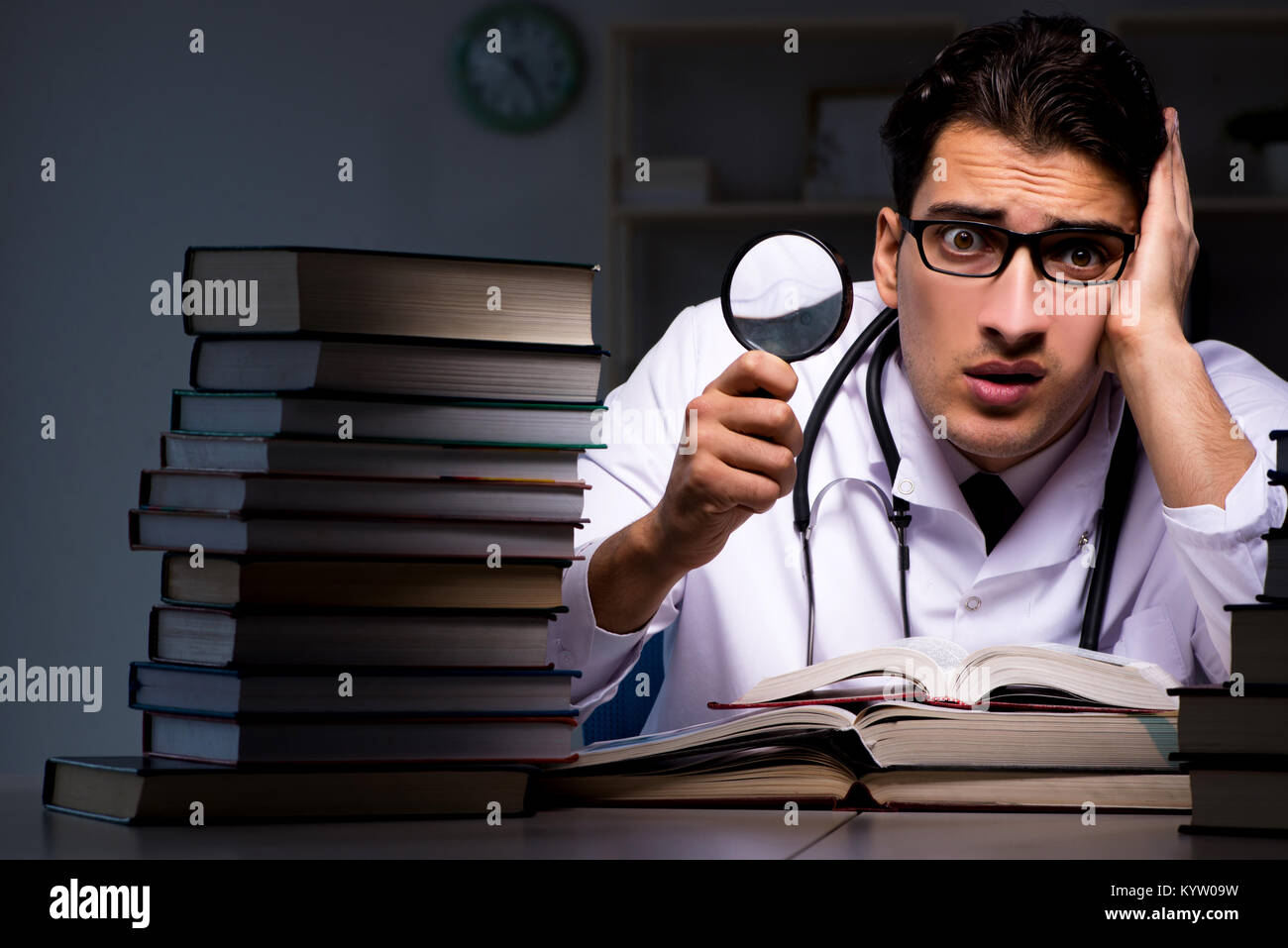 Medical student preparing for university exams at night Stock Photo - Alamy
