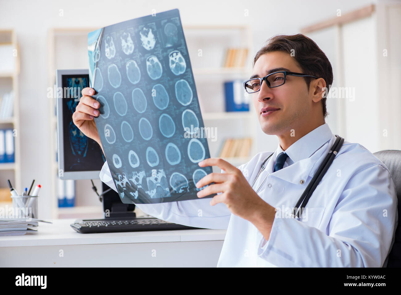 Doctor radiologist looking at x-ray images Stock Photo - Alamy