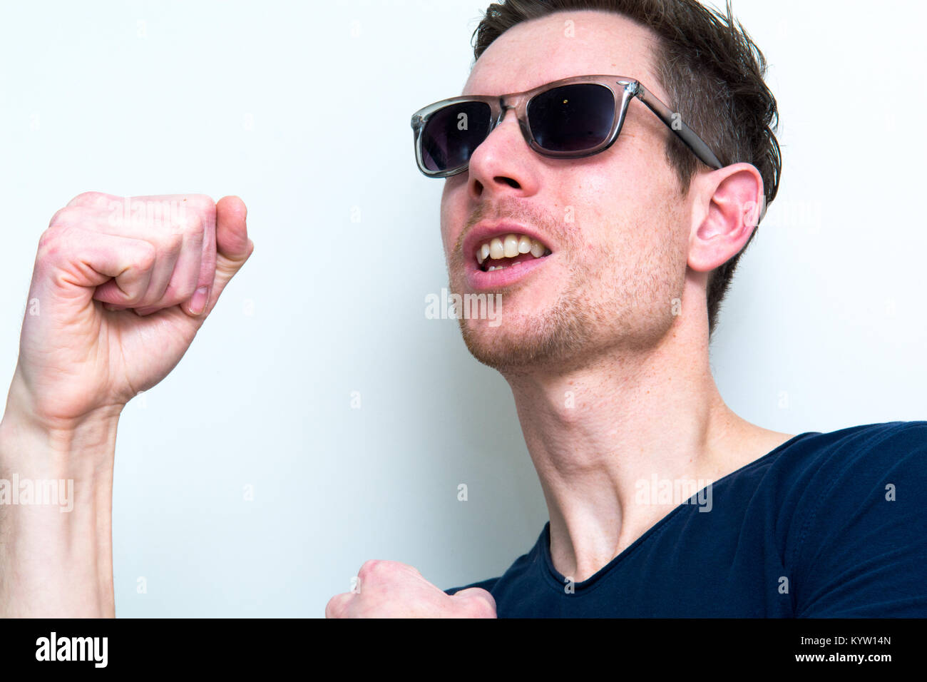 Man celebrating with happy expretion anjd smile Stock Photo - Alamy