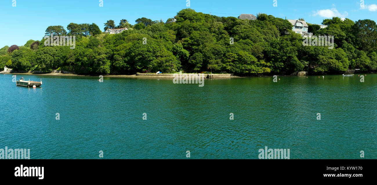 Early summer afternoon sunshine on idyllic small boat moorings in the ...