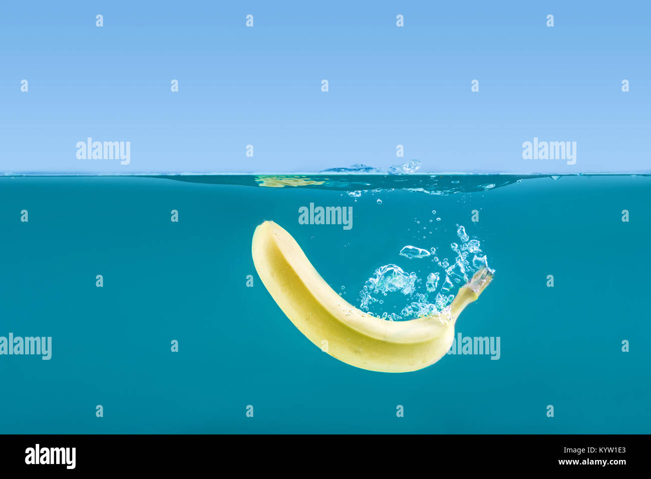 side view of ripe yellow banana floating in water with bubbles Stock ...