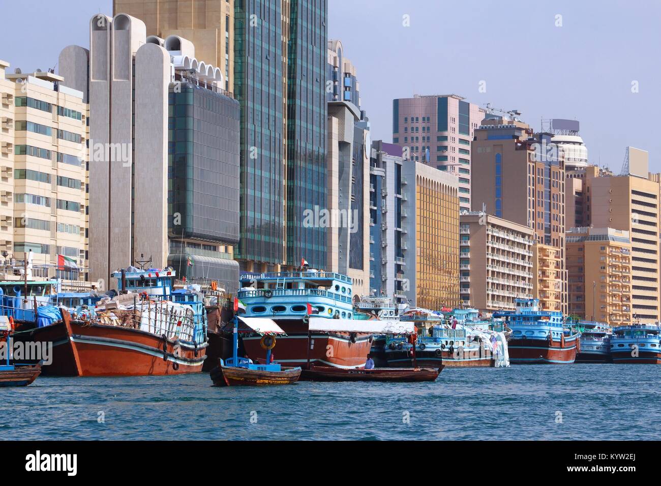 Dubai skyline in Deira district. Dhow ships in harbor Stock Photo - Alamy