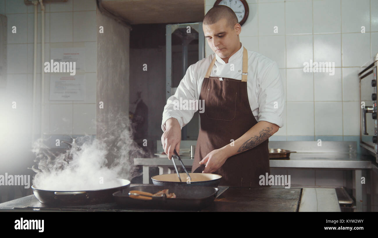 Chef cooking spaghetti in restaurant Stock Photo - Alamy