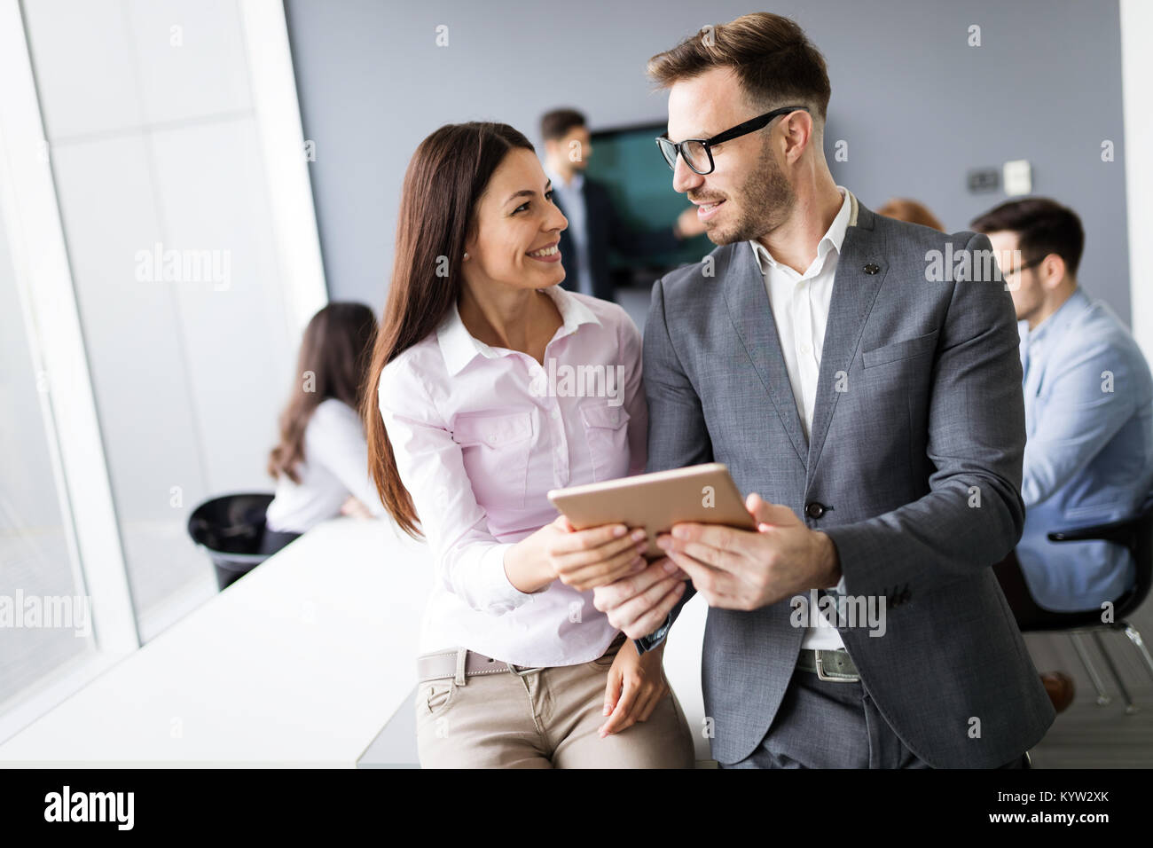 Happy business colleagues in modern office Stock Photo - Alamy