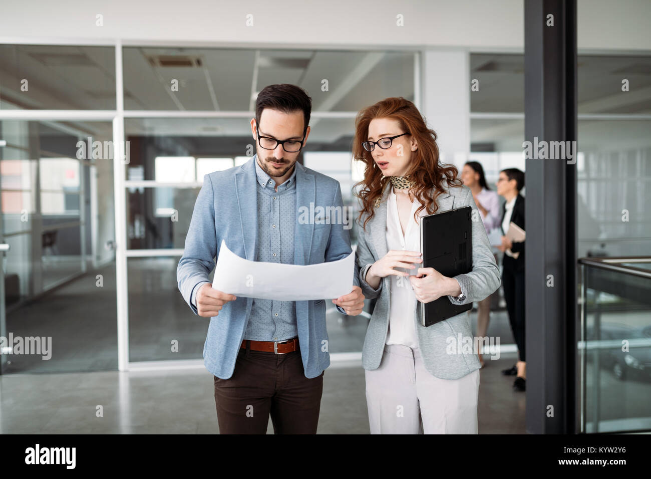 Professional business people working together on project Stock Photo ...