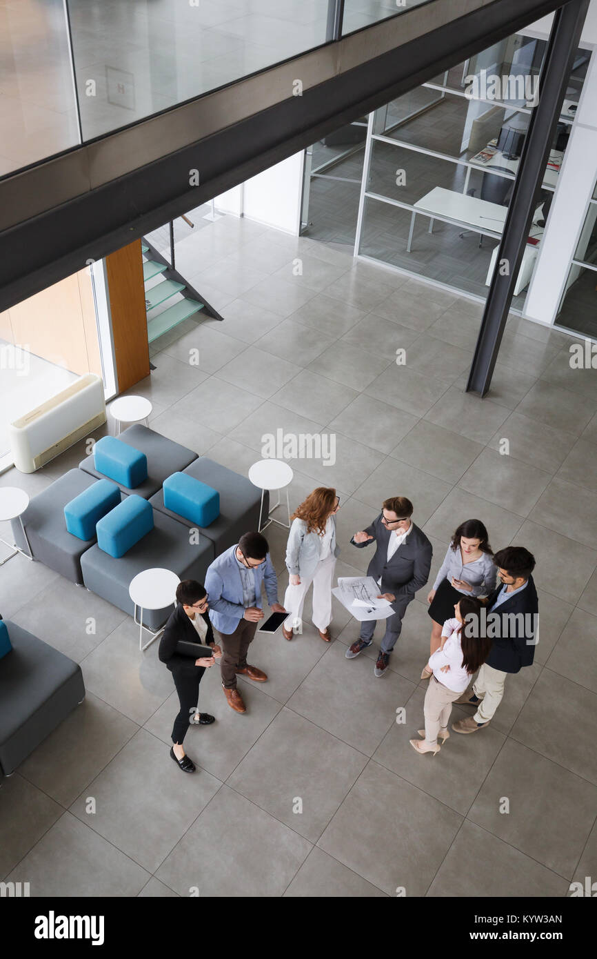 Group of business people collaborating and working on project Stock ...