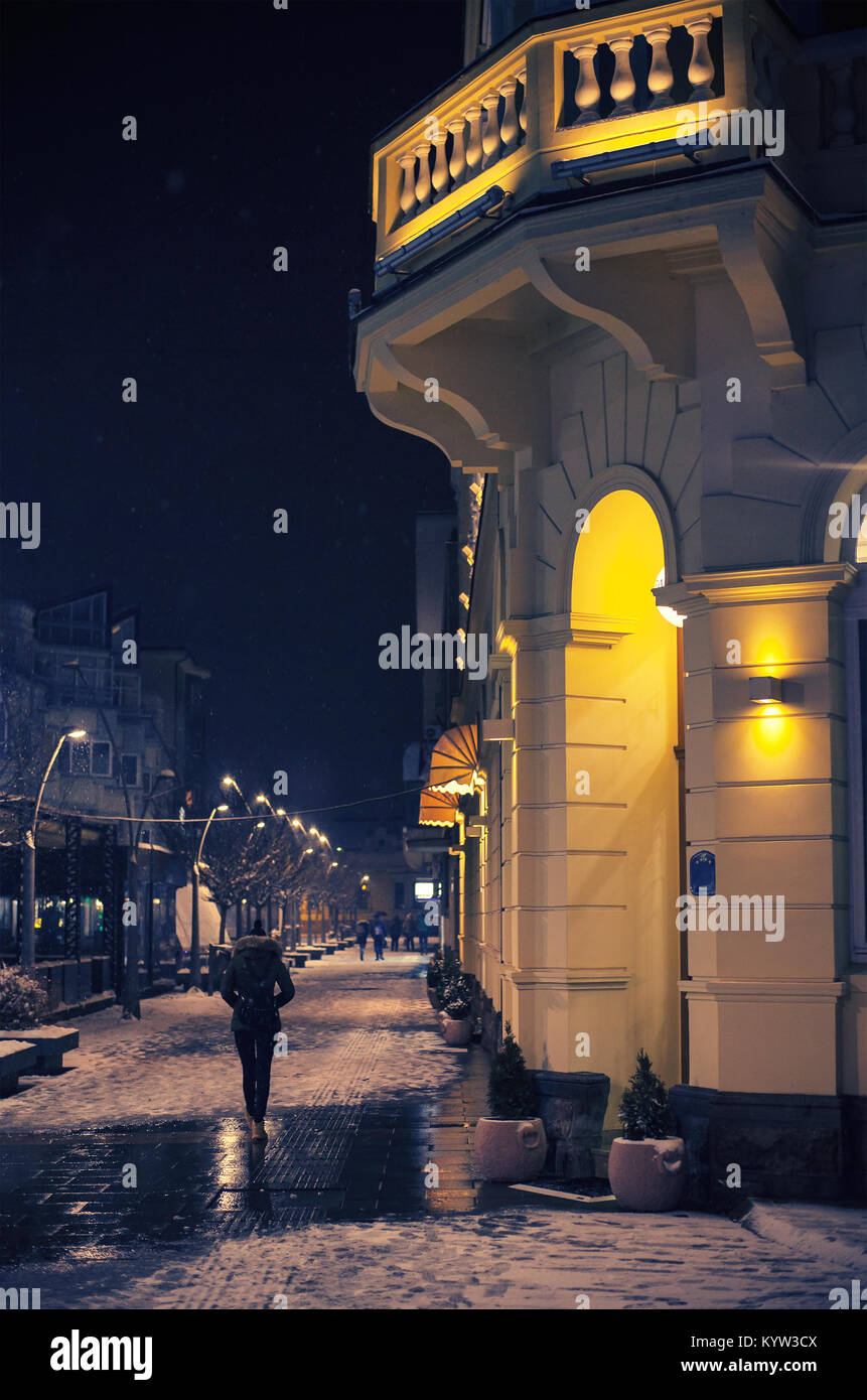 Night scene from the city promenade, entrance to the hotel with a ...