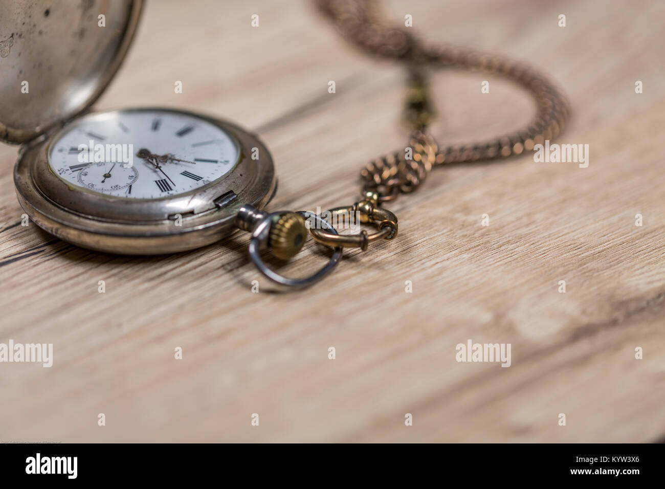 Vintage pocket-watch on the rustic desk Stock Photo - Alamy