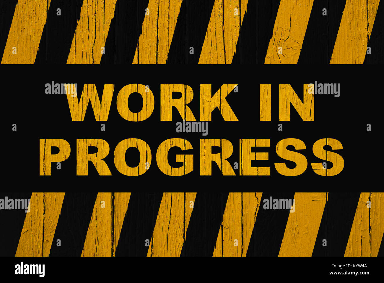 Work in progress warning sign with dark yellow orange and black stripes ...