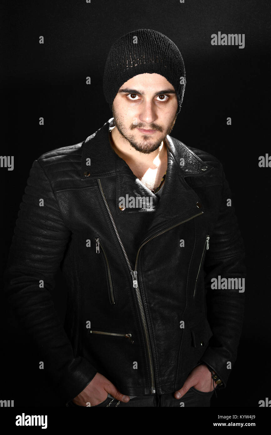 Rocker series. A man in leather jacket portrait black background Stock ...