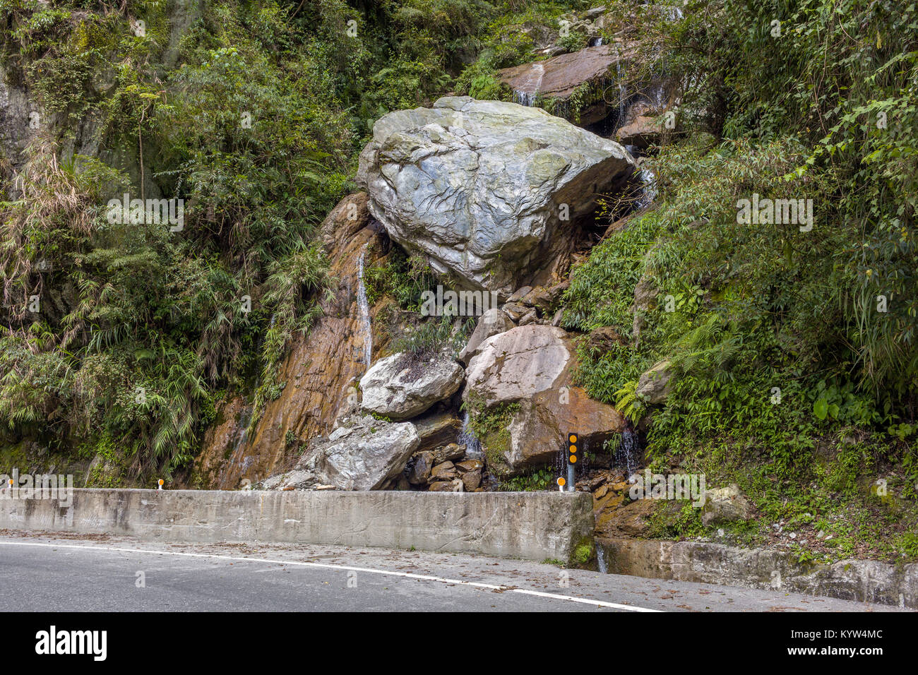 Huge rock is sliding slowly on a waterfall in the direction of Pacific ...
