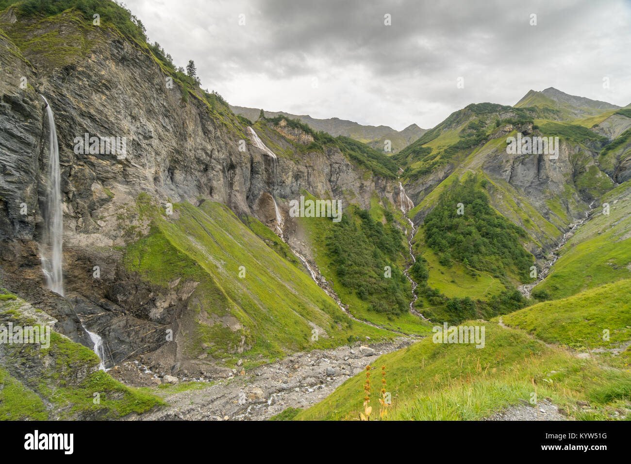 beautiful natural amphitheater with many waterfalls in the Alps of ...