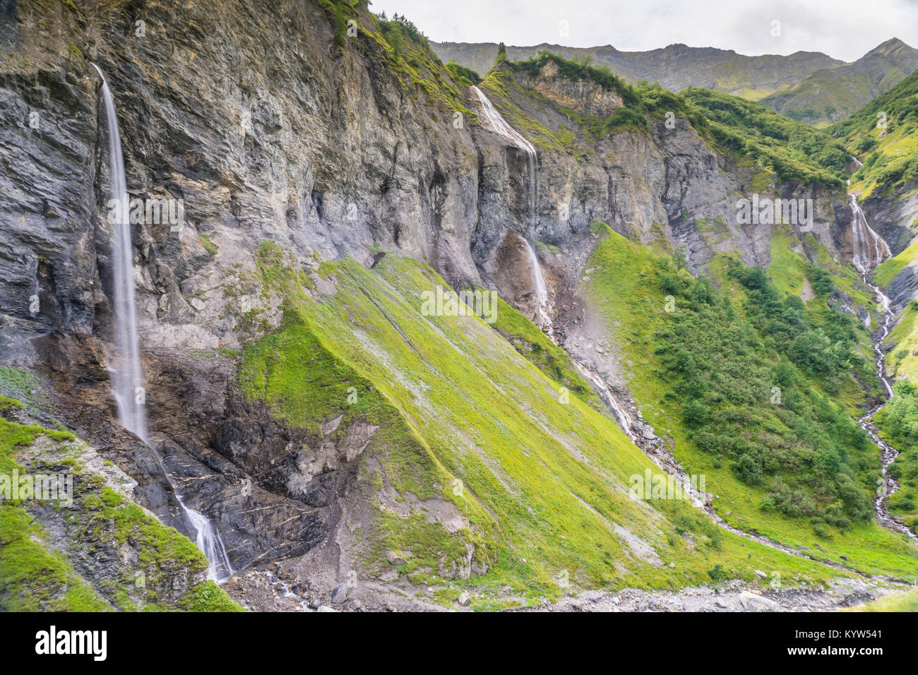 beautiful natural amphitheater with many waterfalls in the Alps of ...