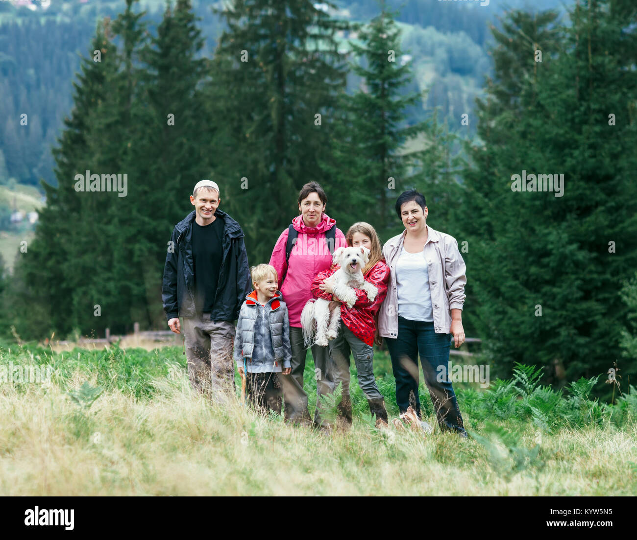 Portrait of happy family against tree background outdoors. Five family ...