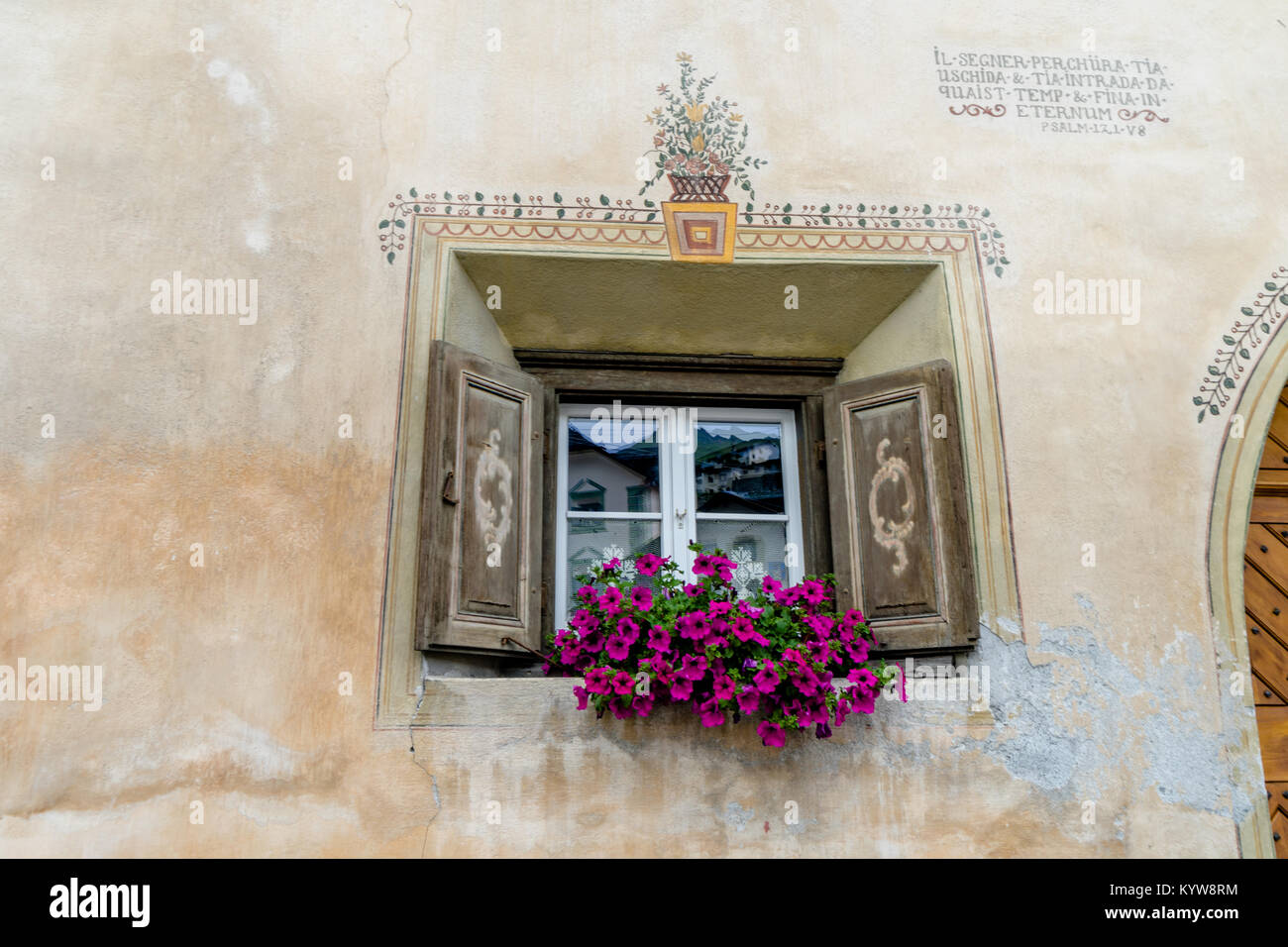 window with classic fresco painting in the Engadin architecture style ...