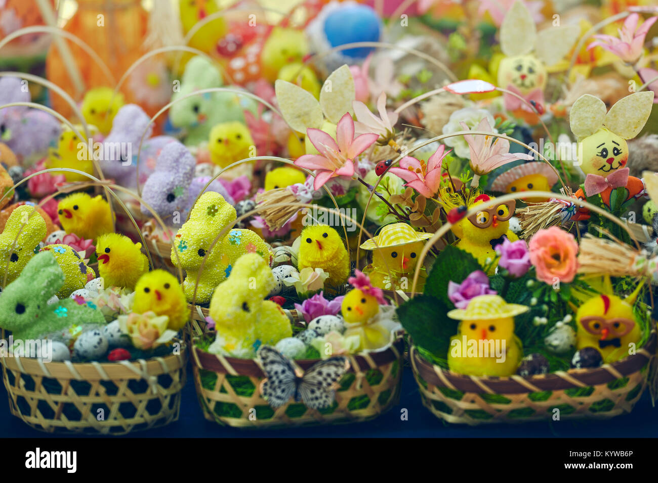 Knitted baskets filled with handmade figurines of Easter bunnies ...