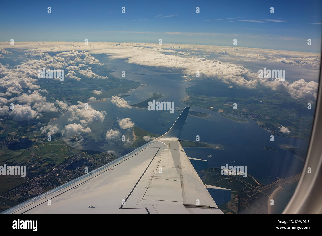 view of the earth from the airplane window. The wing of the plane ...