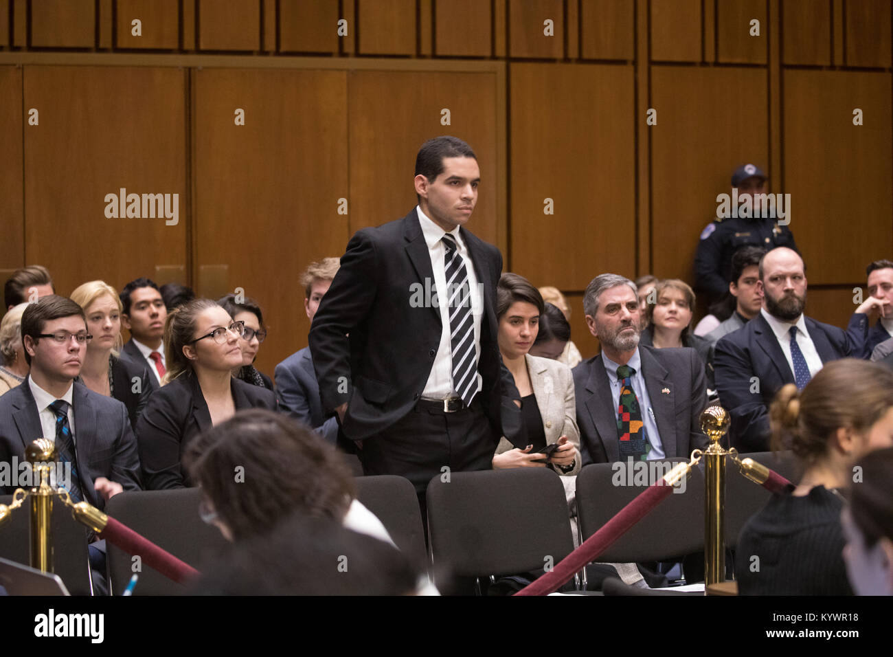 John Magdaleno stands after being introduced by Sen. Dick Durbin (D-Ill ...