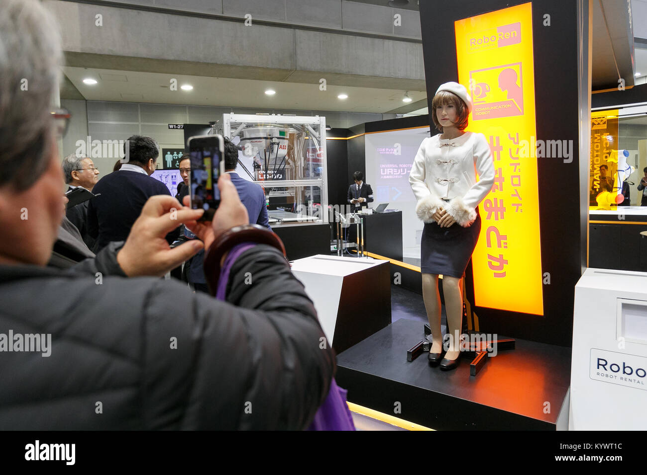 Tokyo, Japan. 17th Jan, 2018. A visitor takes a picture of an humanoid ...