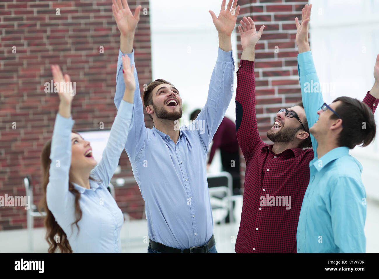 Happy smiling business team in office Stock Photo - Alamy