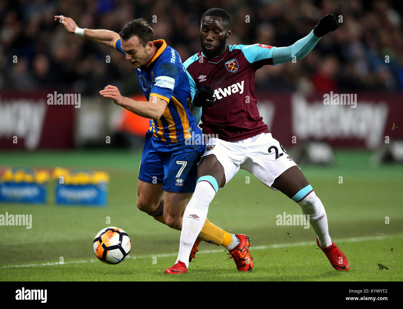 Shrewsbury Town's Shaun Whalley (left) and West Ham United's Arthur ...