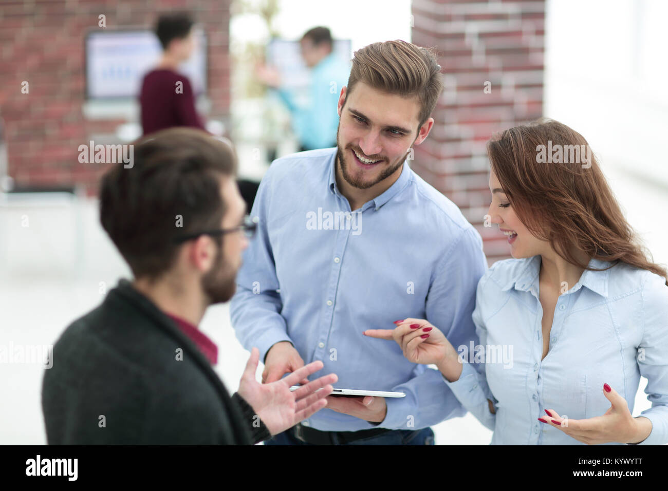Business team with tablet in office Stock Photo - Alamy