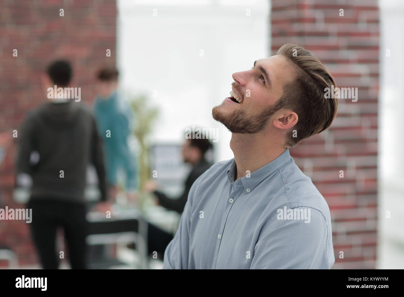 Cheerful man smiling in office Stock Photo - Alamy