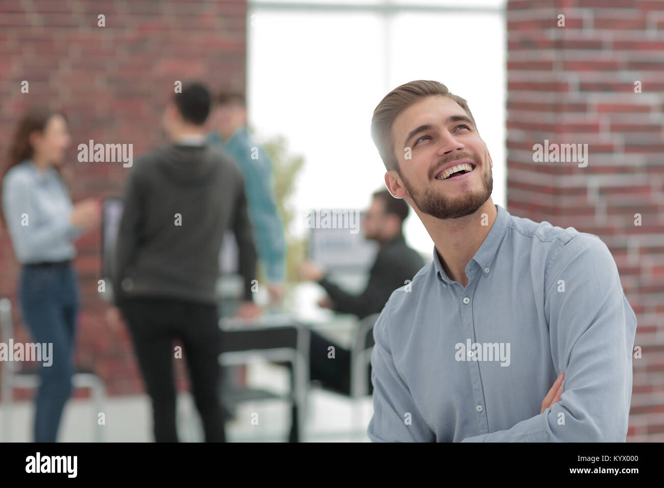 Cheerful man smiling in office Stock Photo - Alamy
