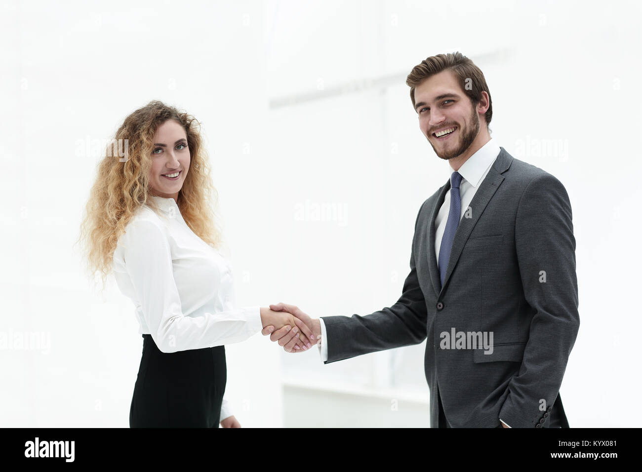 handshake Manager and client on blurred background Stock Photo - Alamy