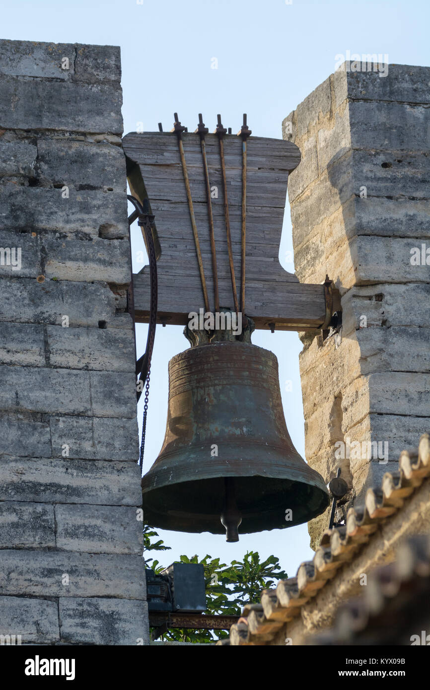 Big bell on the old stone fortress wall Stock Photo - Alamy
