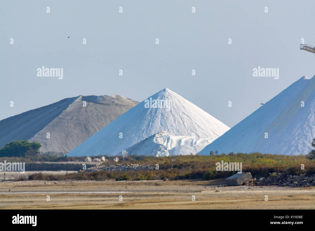 Salt works, industrial plant with white piles of Camagrue sea salt ...
