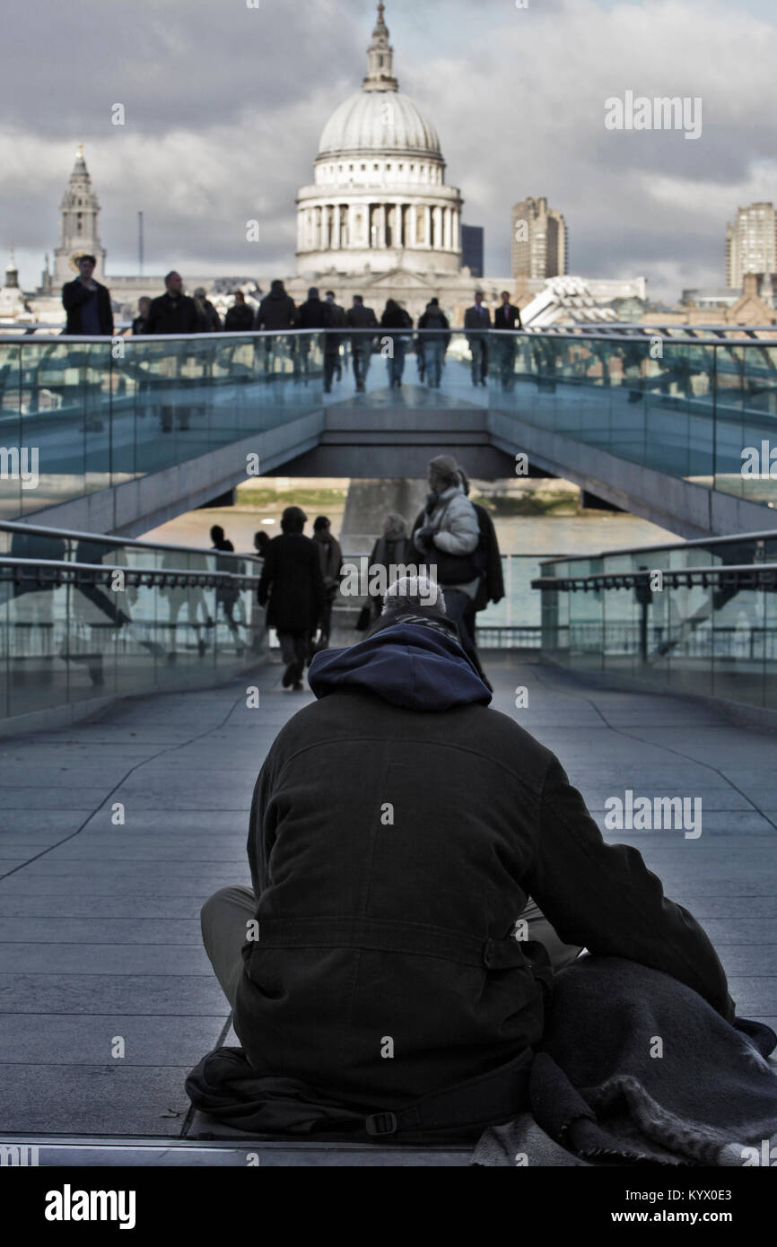 A young homeless man waits with his dog at the end of the millennium ...