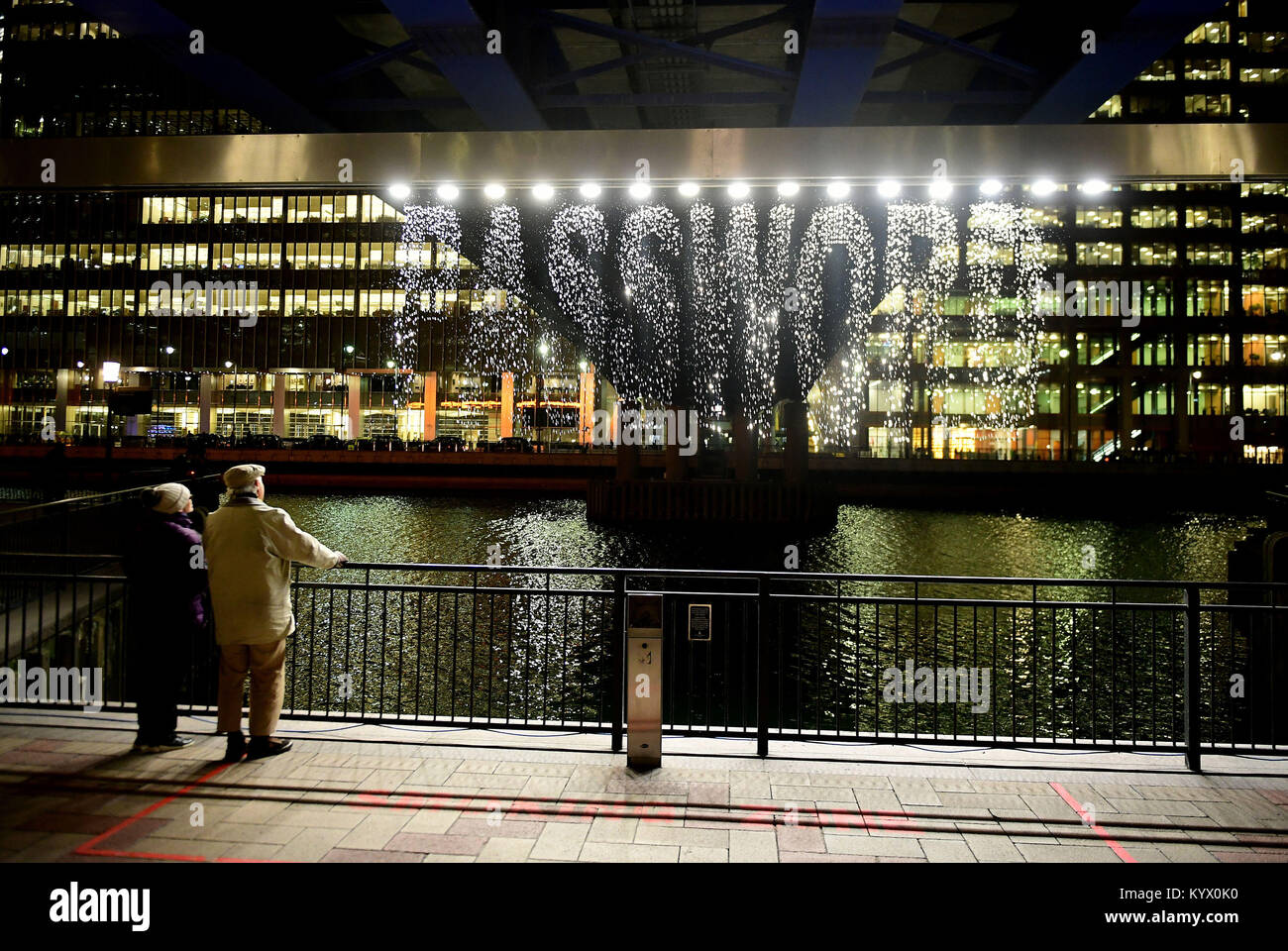 A couple look upon Bit Fall, an installation presented at the Canary ...