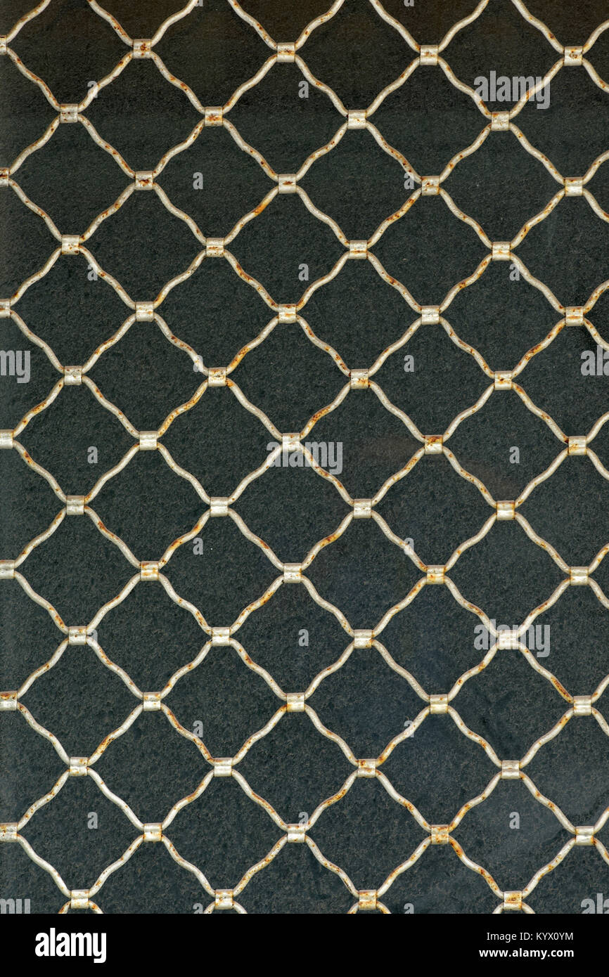 A chain. Link wire fence close up showing the design and pattern of the ...