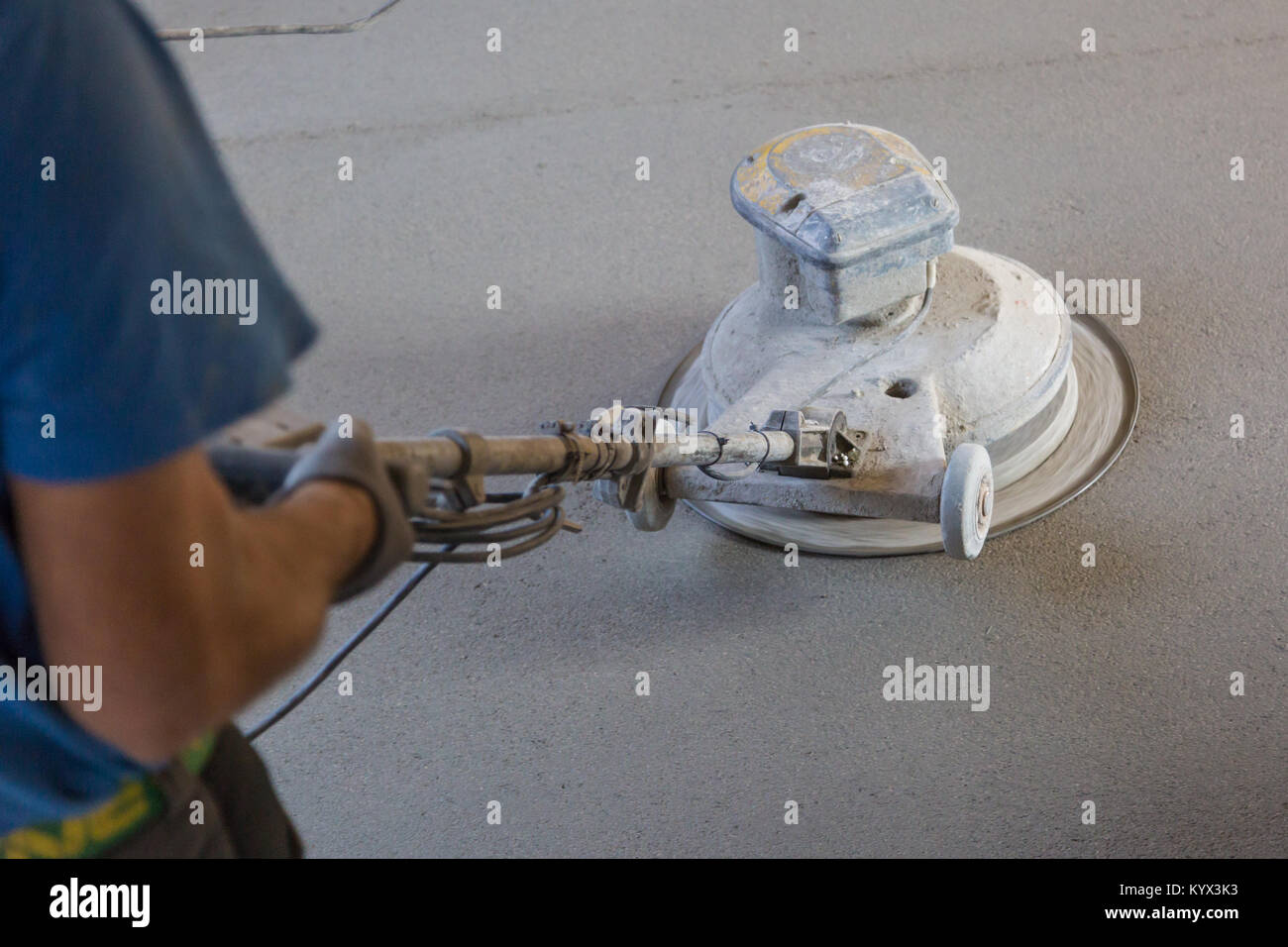 Laborer polishing sand and cement screed floor Stock Photo - Alamy