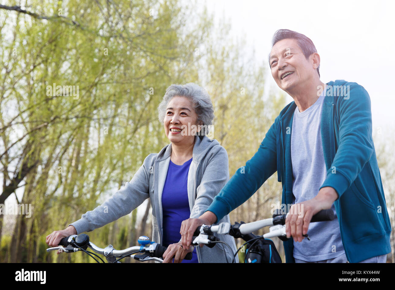Outdoor riding bicycle for old couple Stock Photo - Alamy