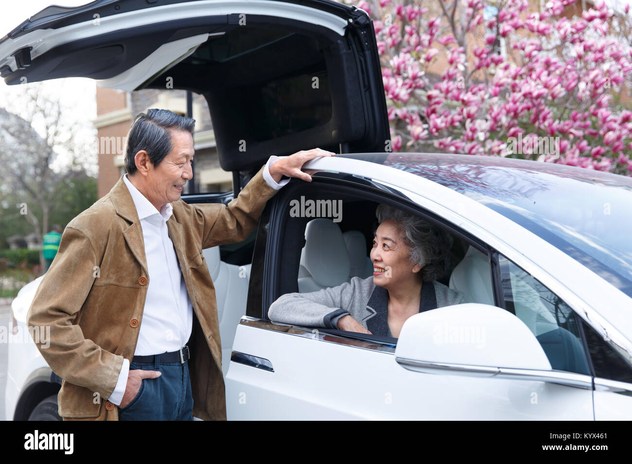 Old couple driving Stock Photo - Alamy