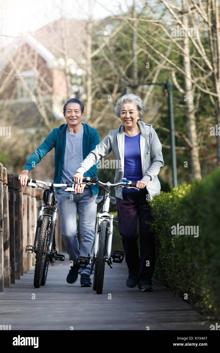 Outdoor riding bicycle for old couple Stock Photo - Alamy