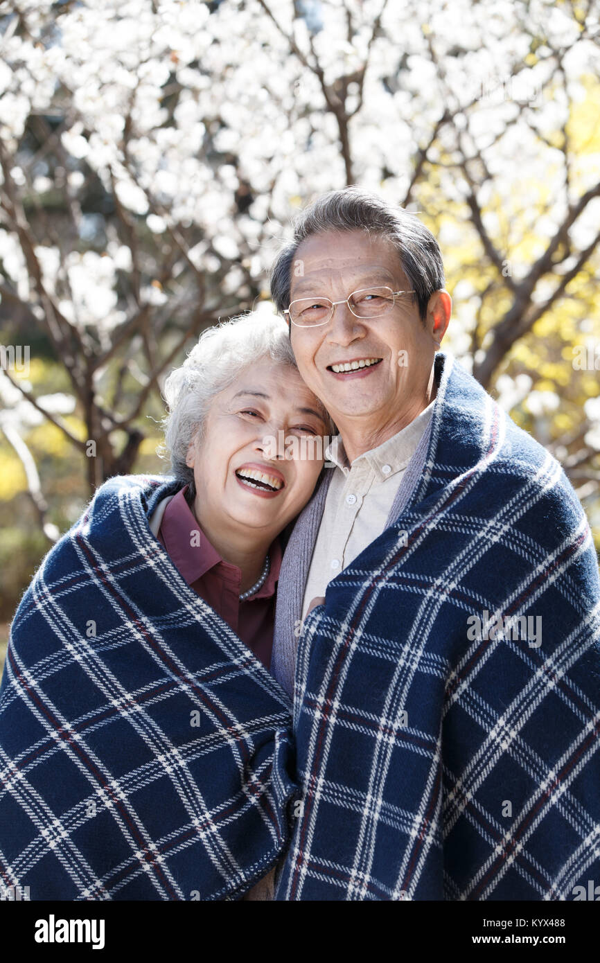 Old couple embracing in bed hi-res stock photography and images - Alamy