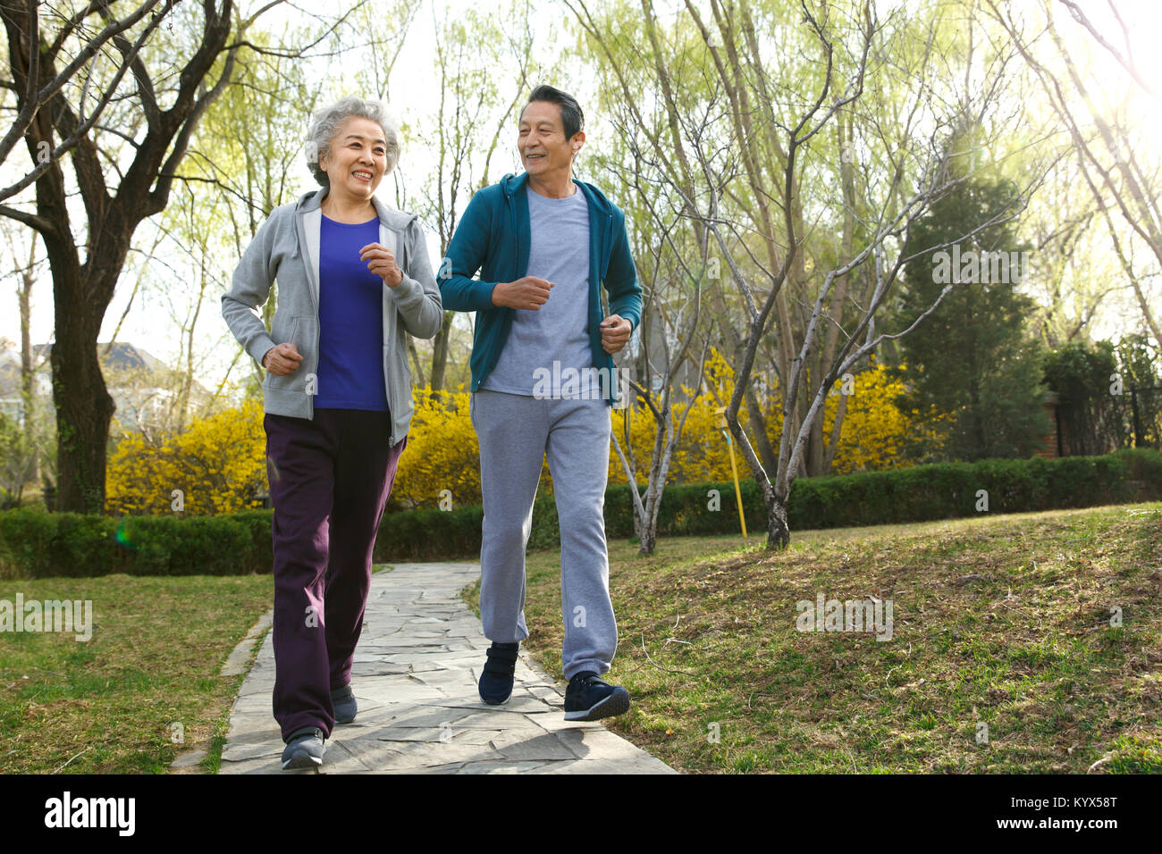 Indian couple jogging in park hi-res stock photography and images - Alamy