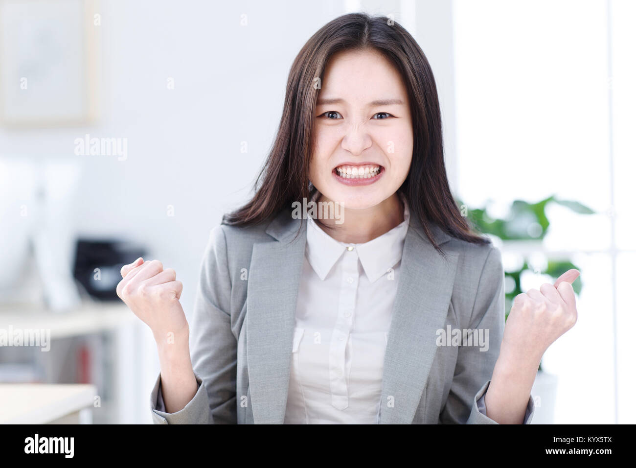 A business woman with a crazy facial expression Stock Photo - Alamy