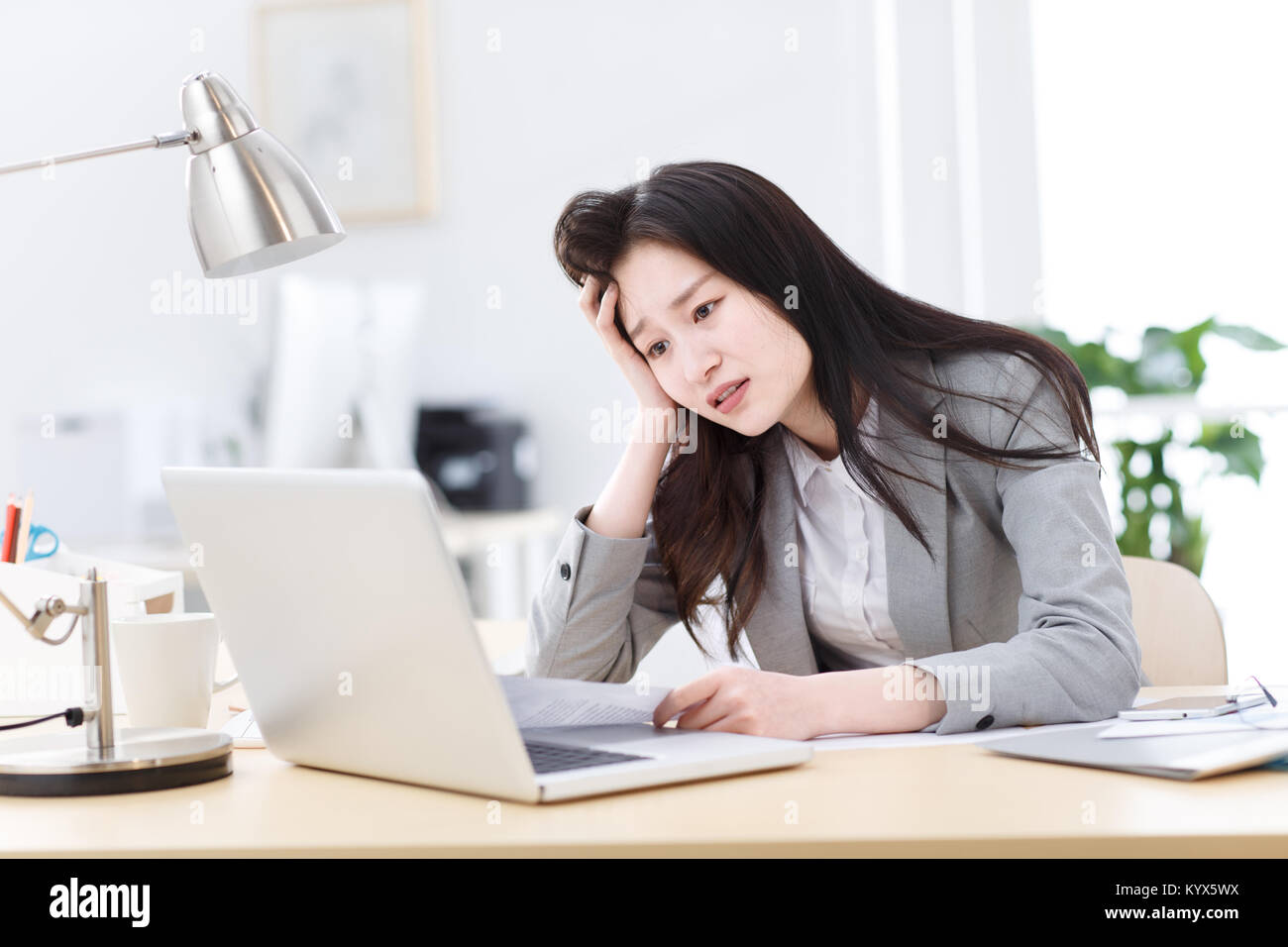 A dejected business woman Stock Photo - Alamy