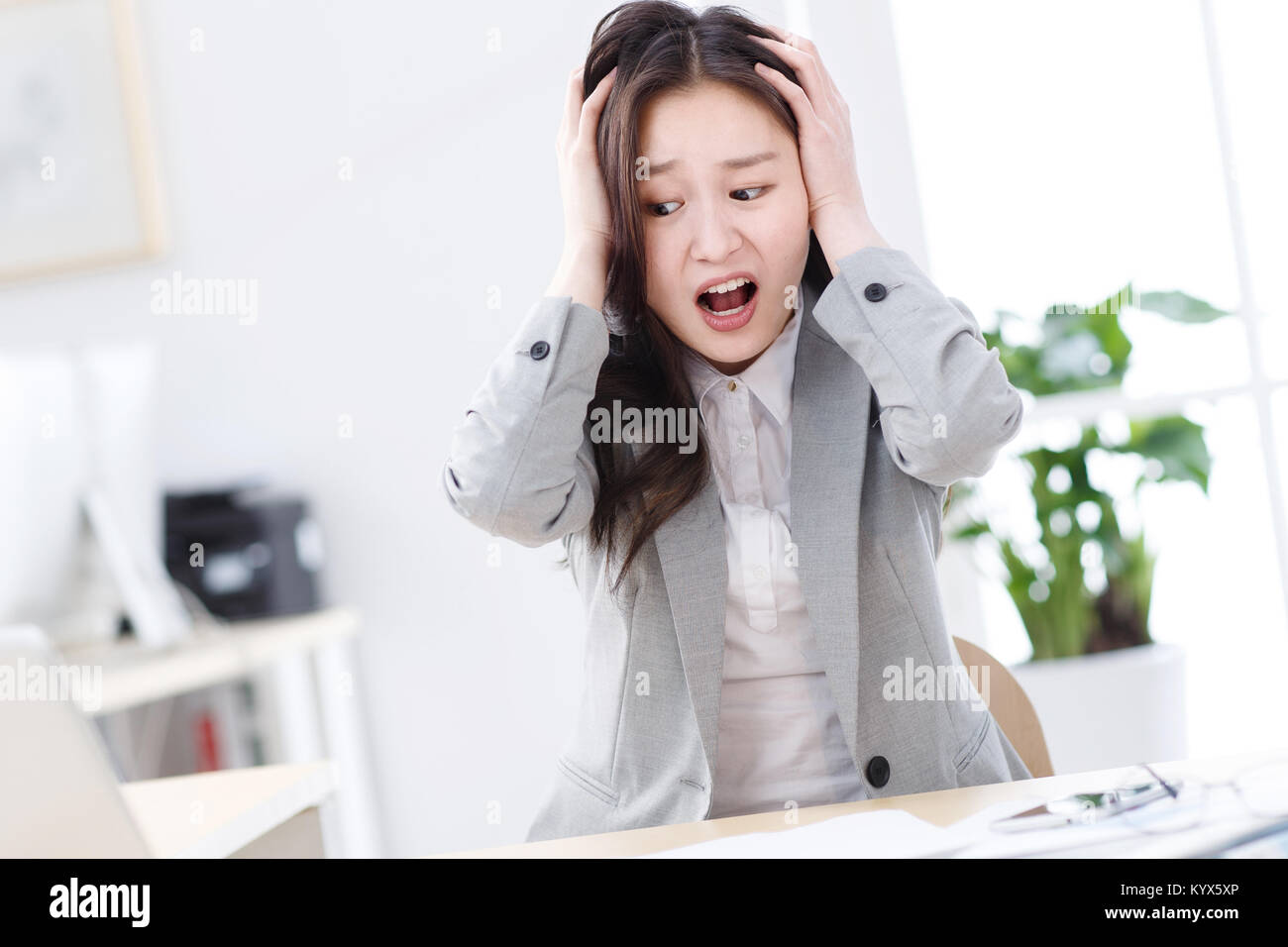 A frightened face; a business woman Stock Photo - Alamy