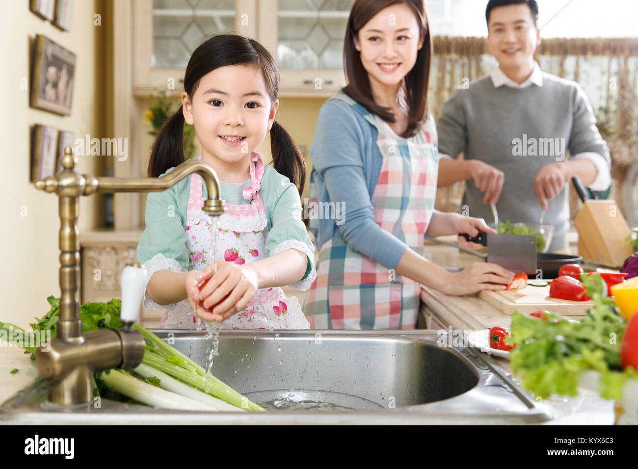 Happy families are in the kitchen Stock Photo - Alamy