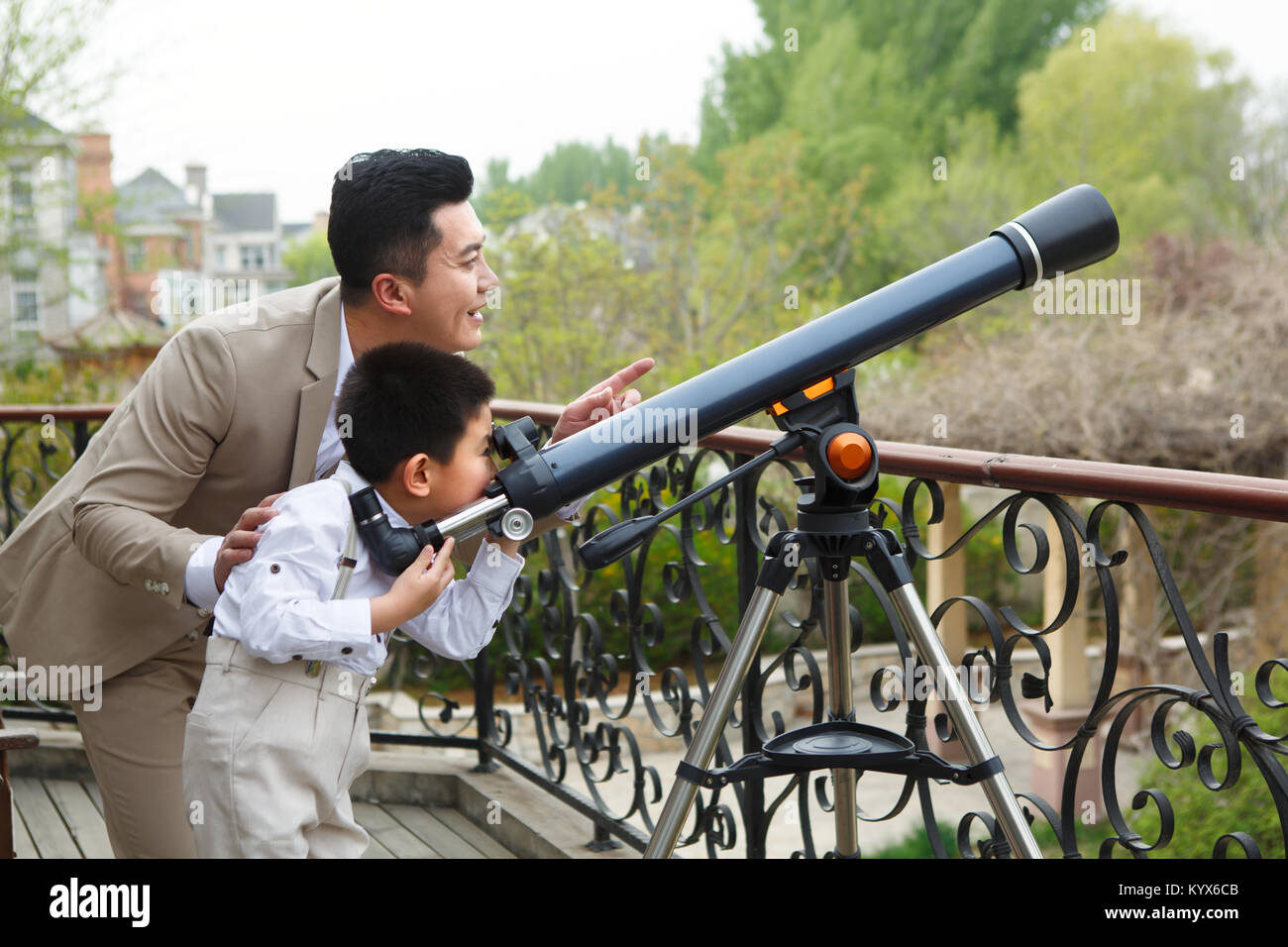 The father and son used an astronomical telescope on the terrace Stock ...