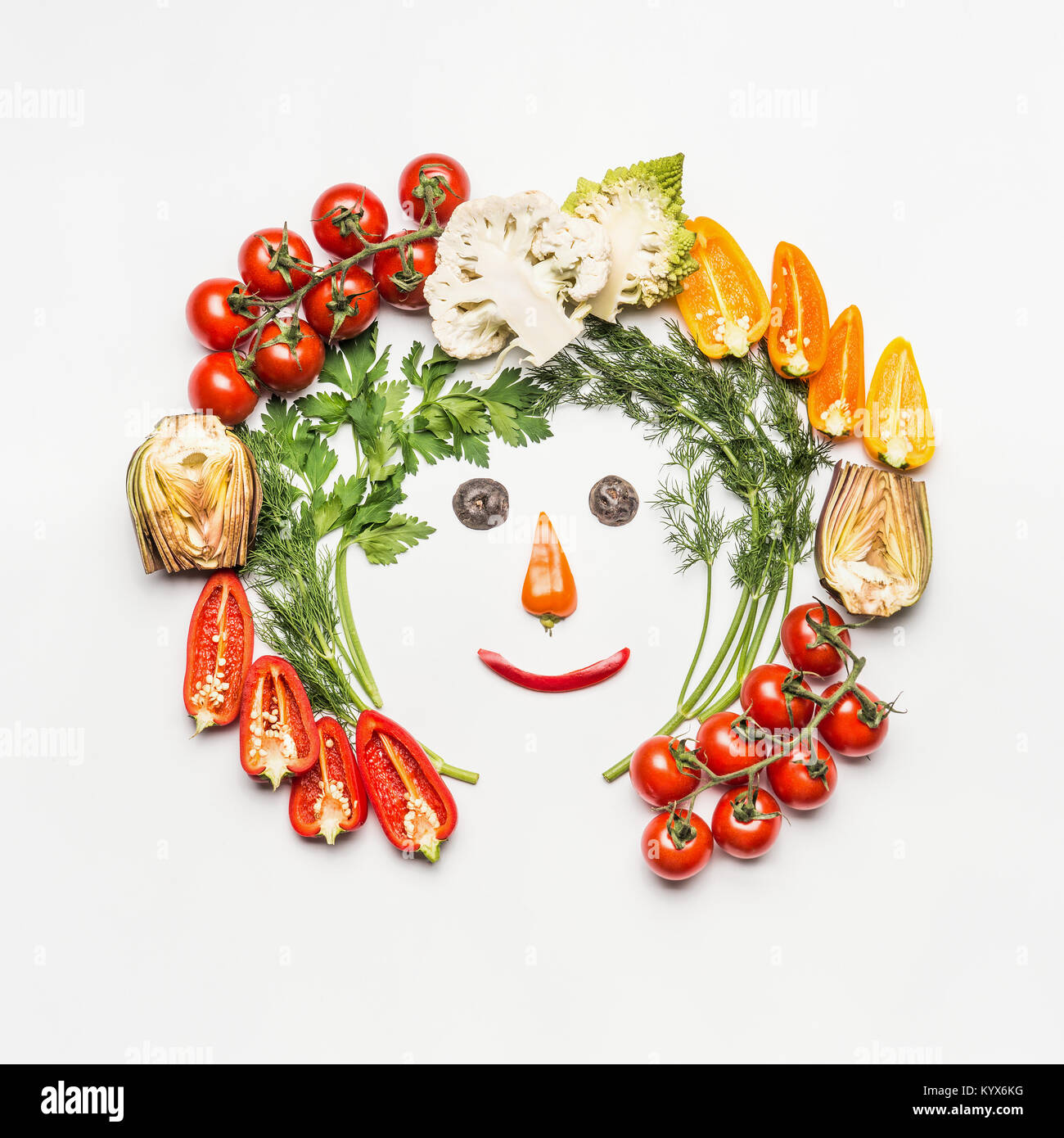 Healthy lifestyle concept. Funny face made with various vegetables ...