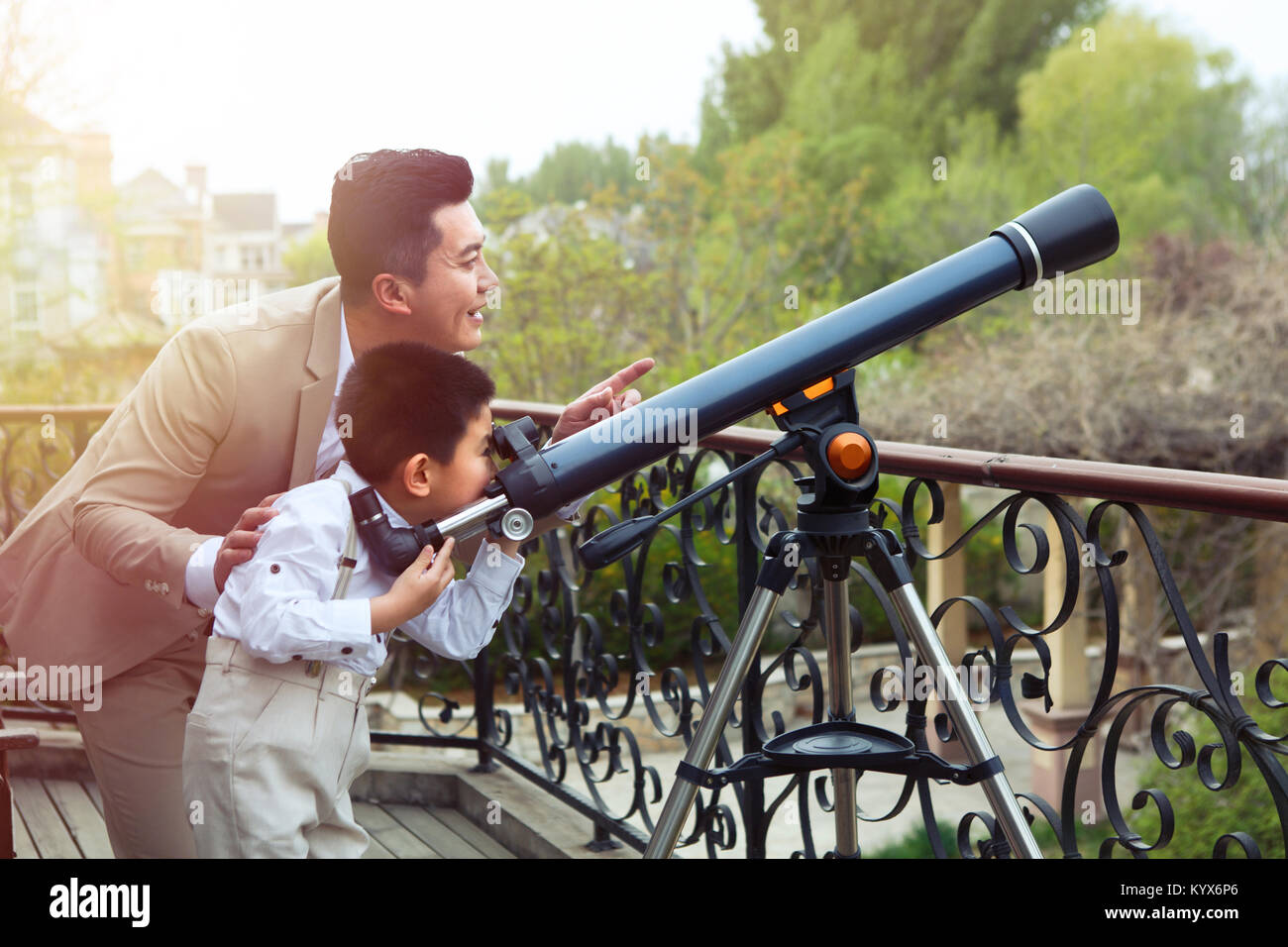 The father and son used an astronomical telescope on the terrace Stock ...